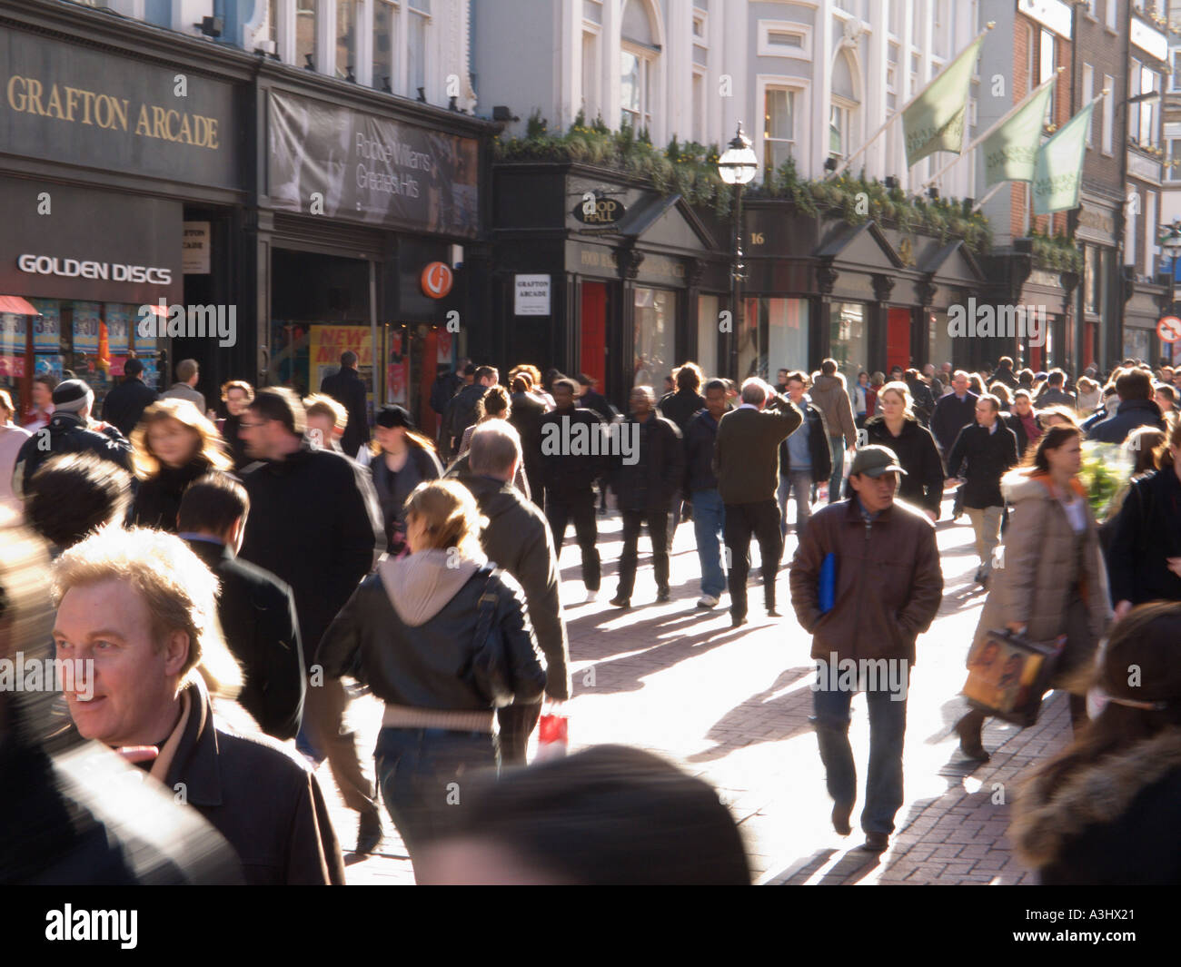 Busy crowded street scene, shopping in Graften Street, Dublin, Ireland ...