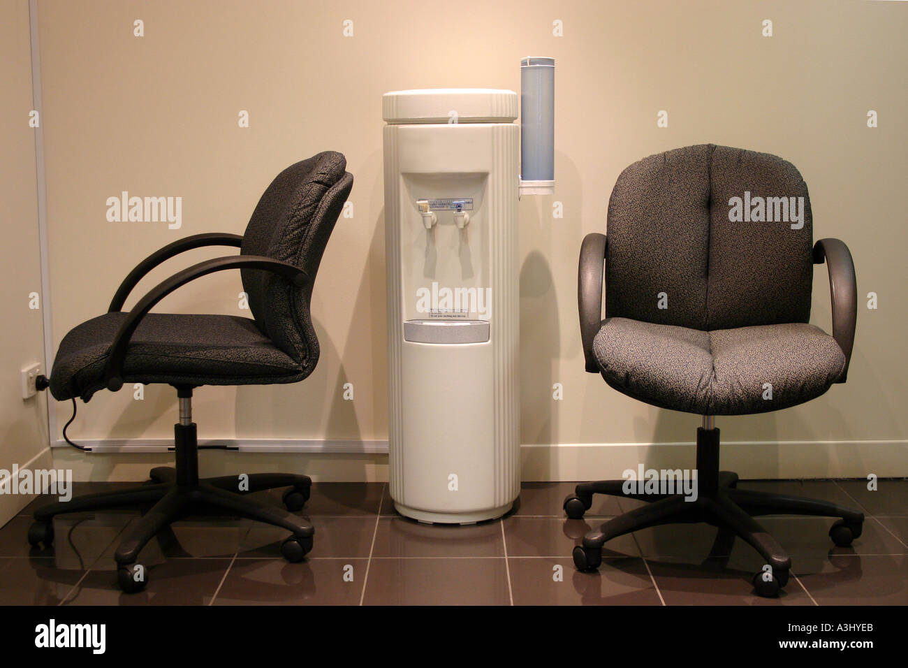 Chairs by the water cooler Stock Photo - Alamy