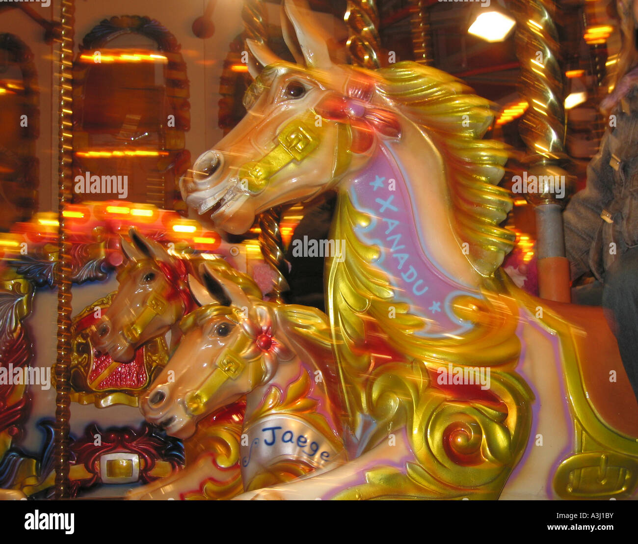 Traditional hobby horse merry go round fairground ride Stock Photo - Alamy