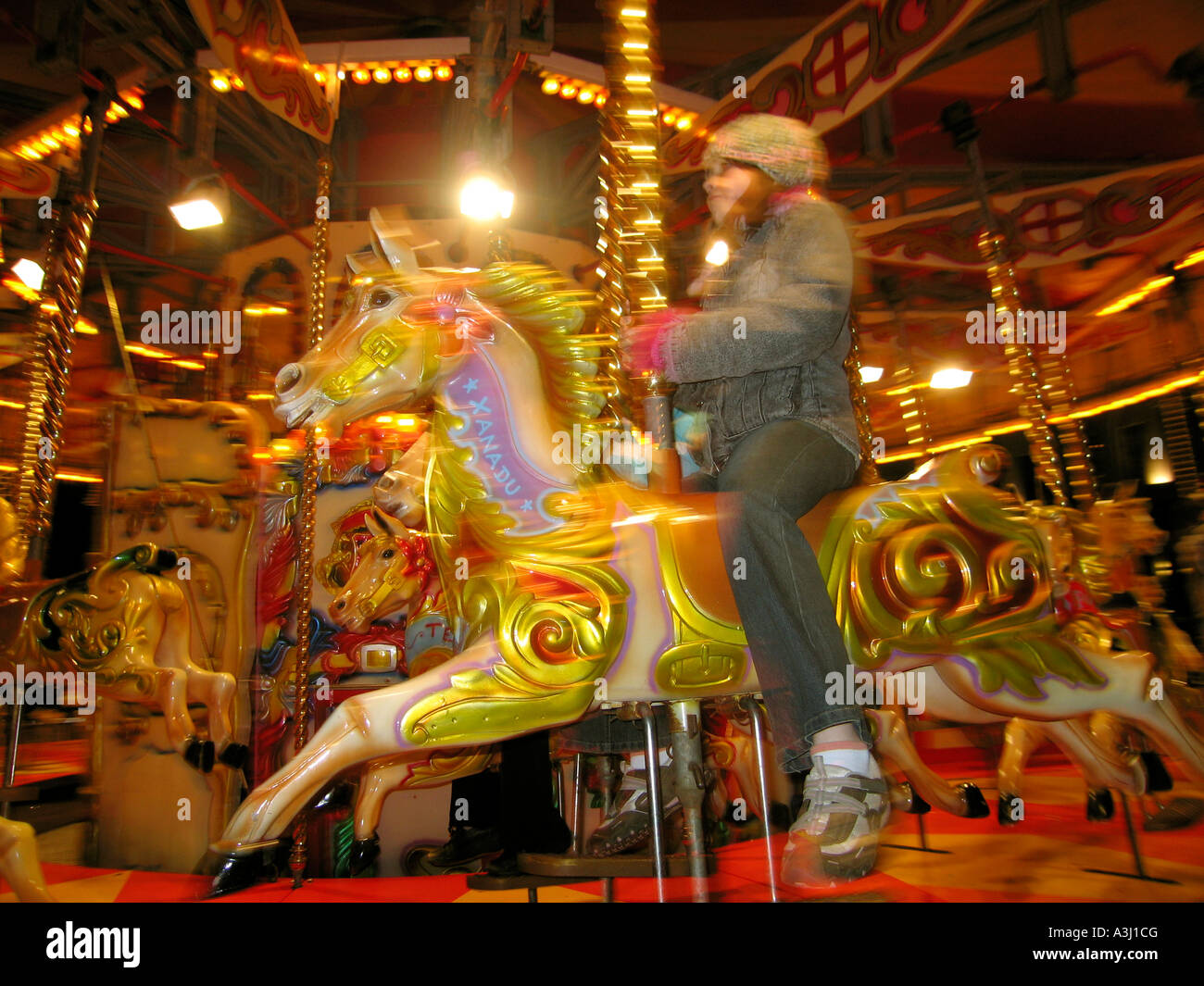 Traditional hobby horse merry go round fairground ride Stock Photo - Alamy