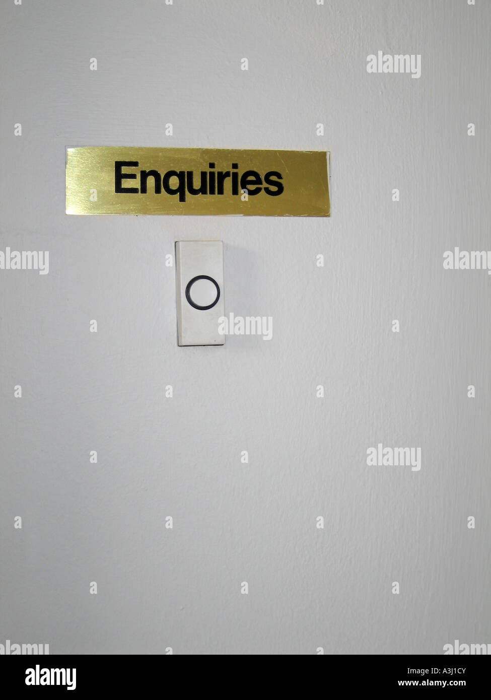 Enquiries bell call button on office wall Stock Photo - Alamy