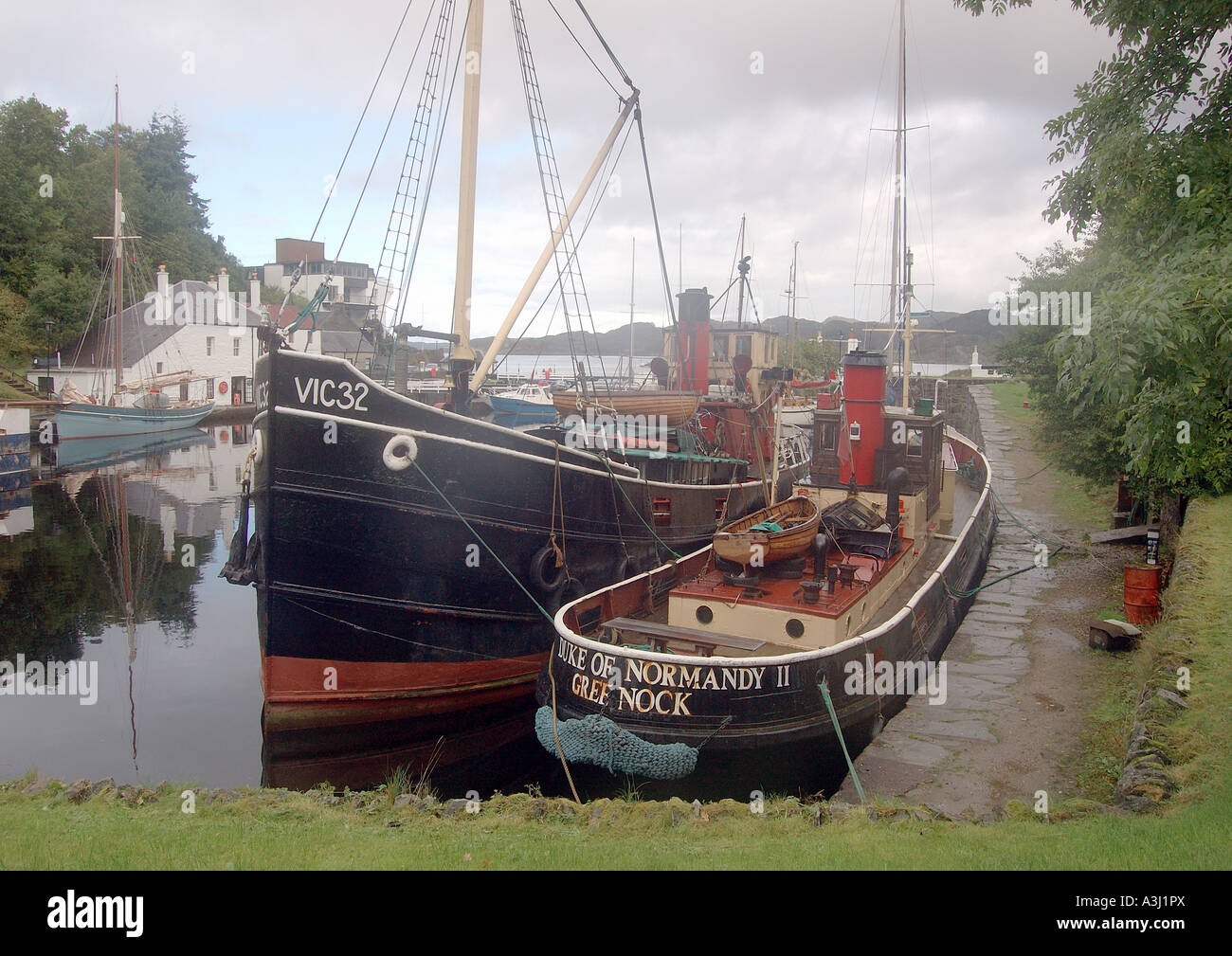 Boats docked in the lock at Crinan at the north end of the Crinan canal ...