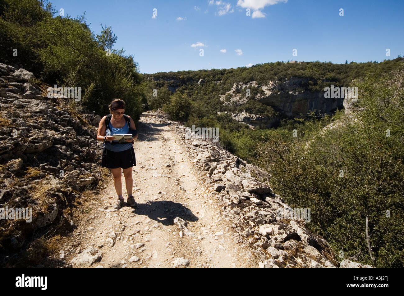 Female walker reading map in Buoux, Vaucluse, Provence Stock Photo - Alamy
