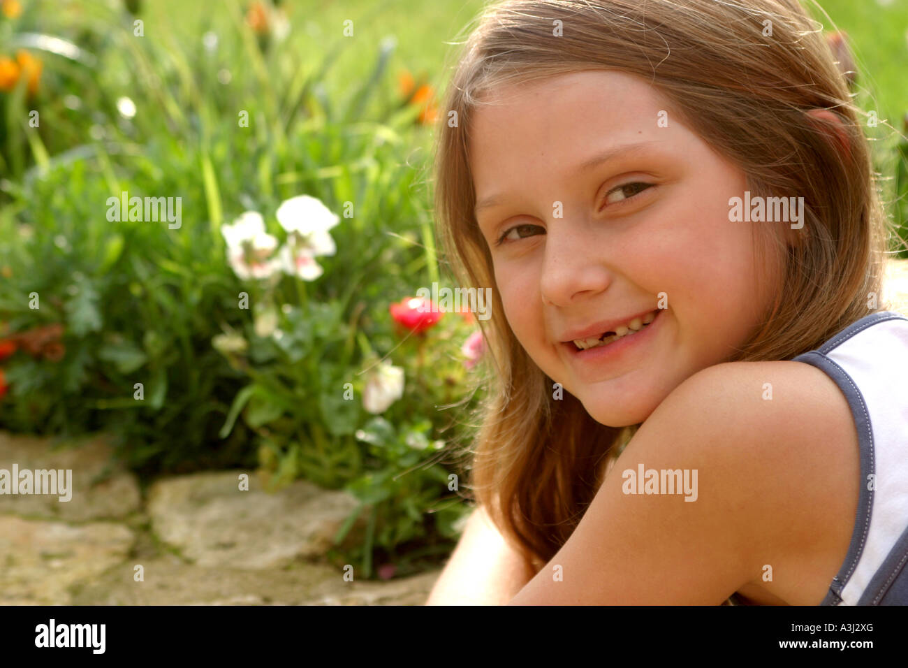 A fun summer portrait of a young English girl with a missing tooth ...