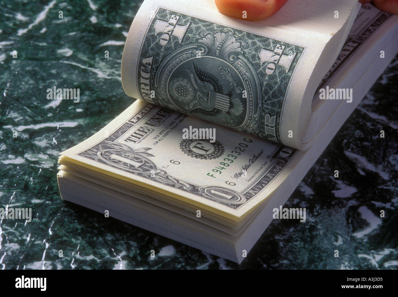 stack of one dollar bills US money Stock Photo - Alamy