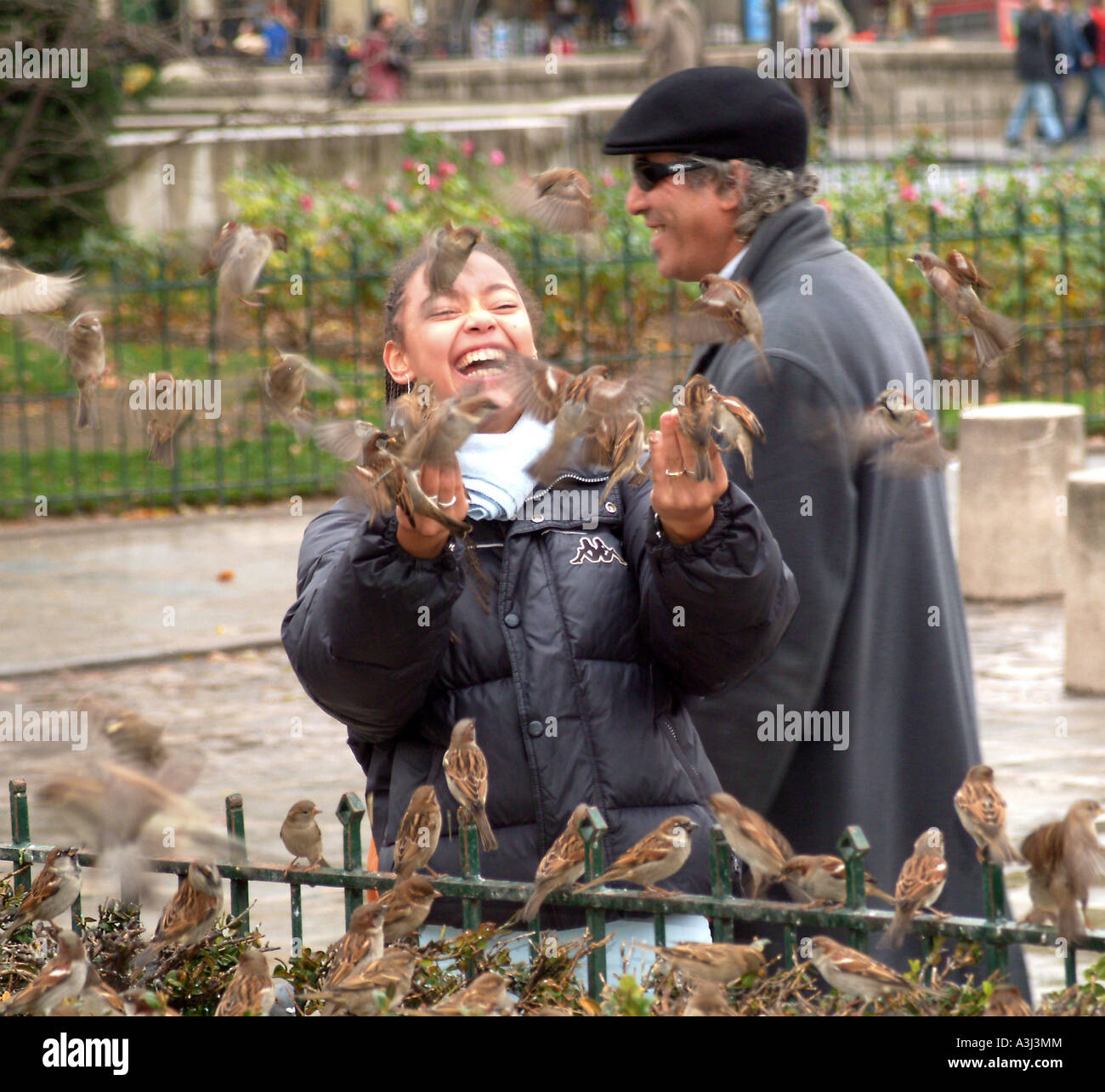 TOURISTS AND BIRDS IN PARIS SQUARE. FRANCE. EUROPE Stock Photo - Alamy