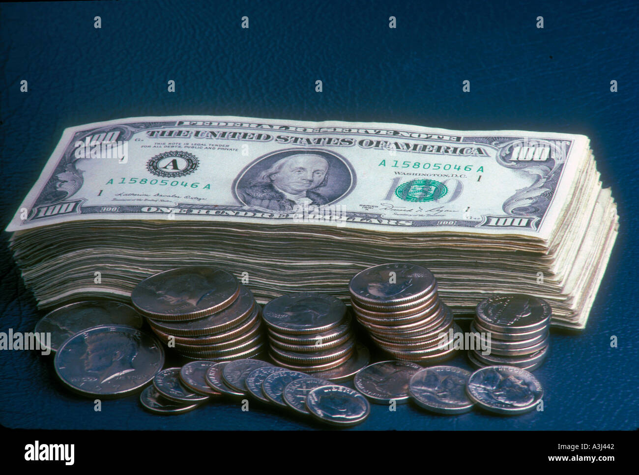 United States money 100 dollar bills and coins Stock Photo - Alamy