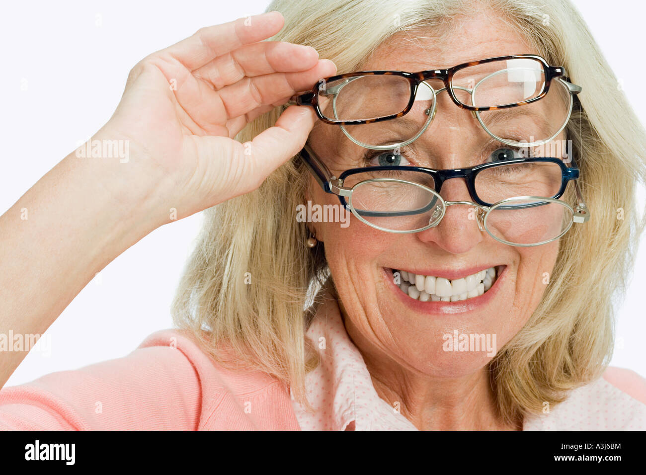 Woman wearing lots of glasses Stock Photo - Alamy