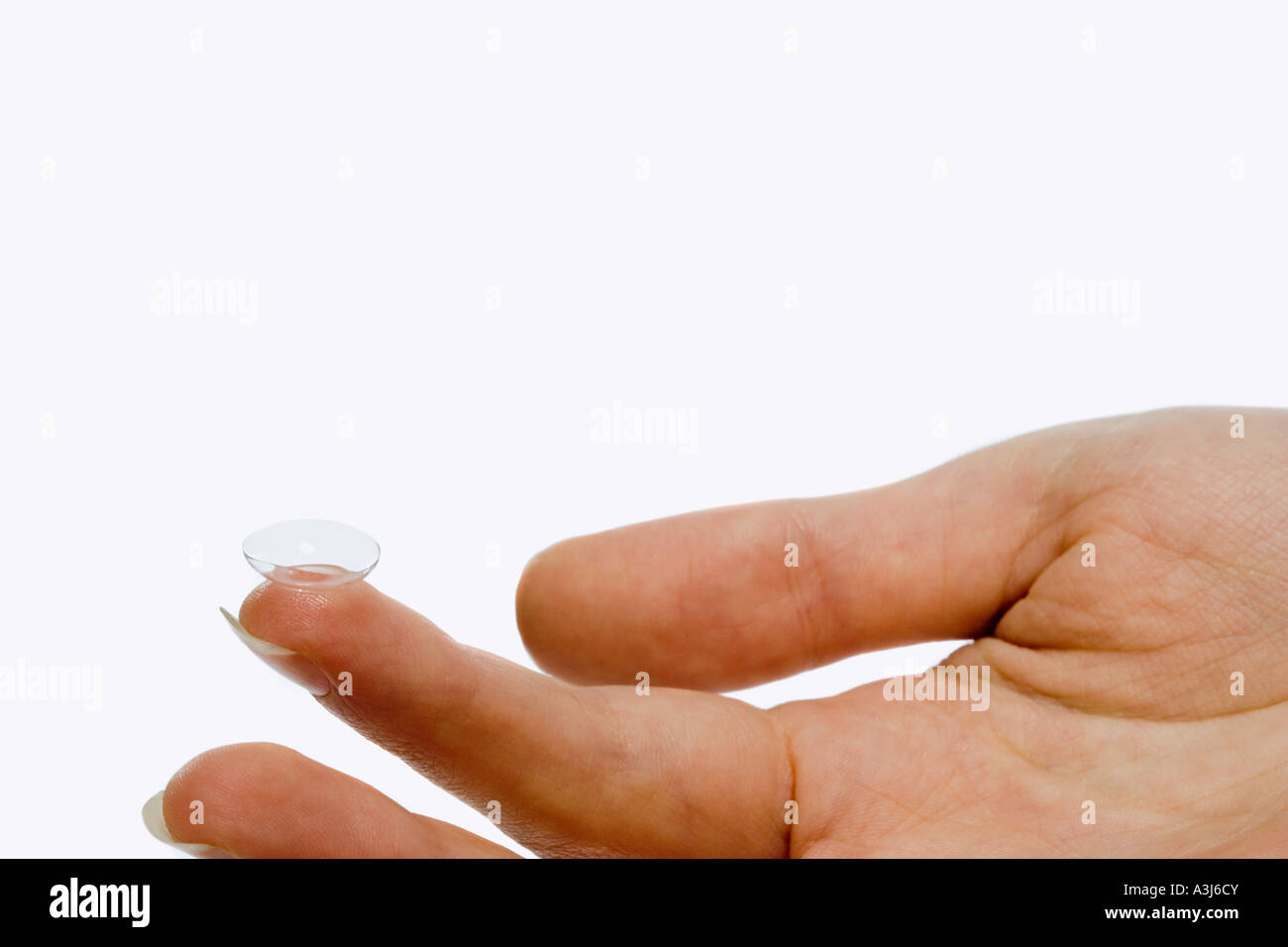 Person holding contact lens Stock Photo - Alamy