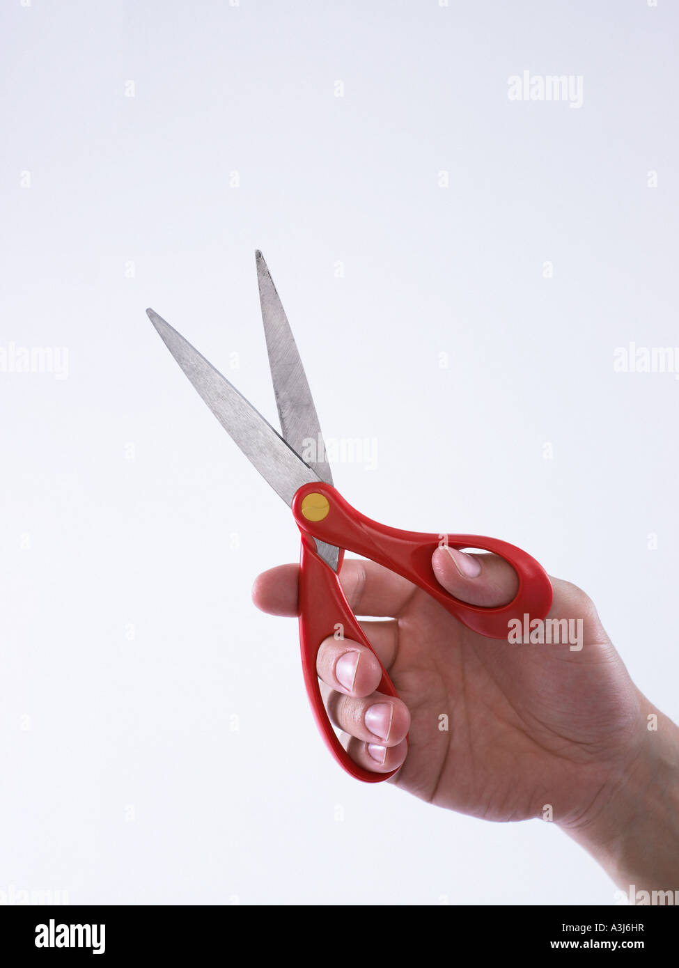 Person holding scissors Stock Photo - Alamy