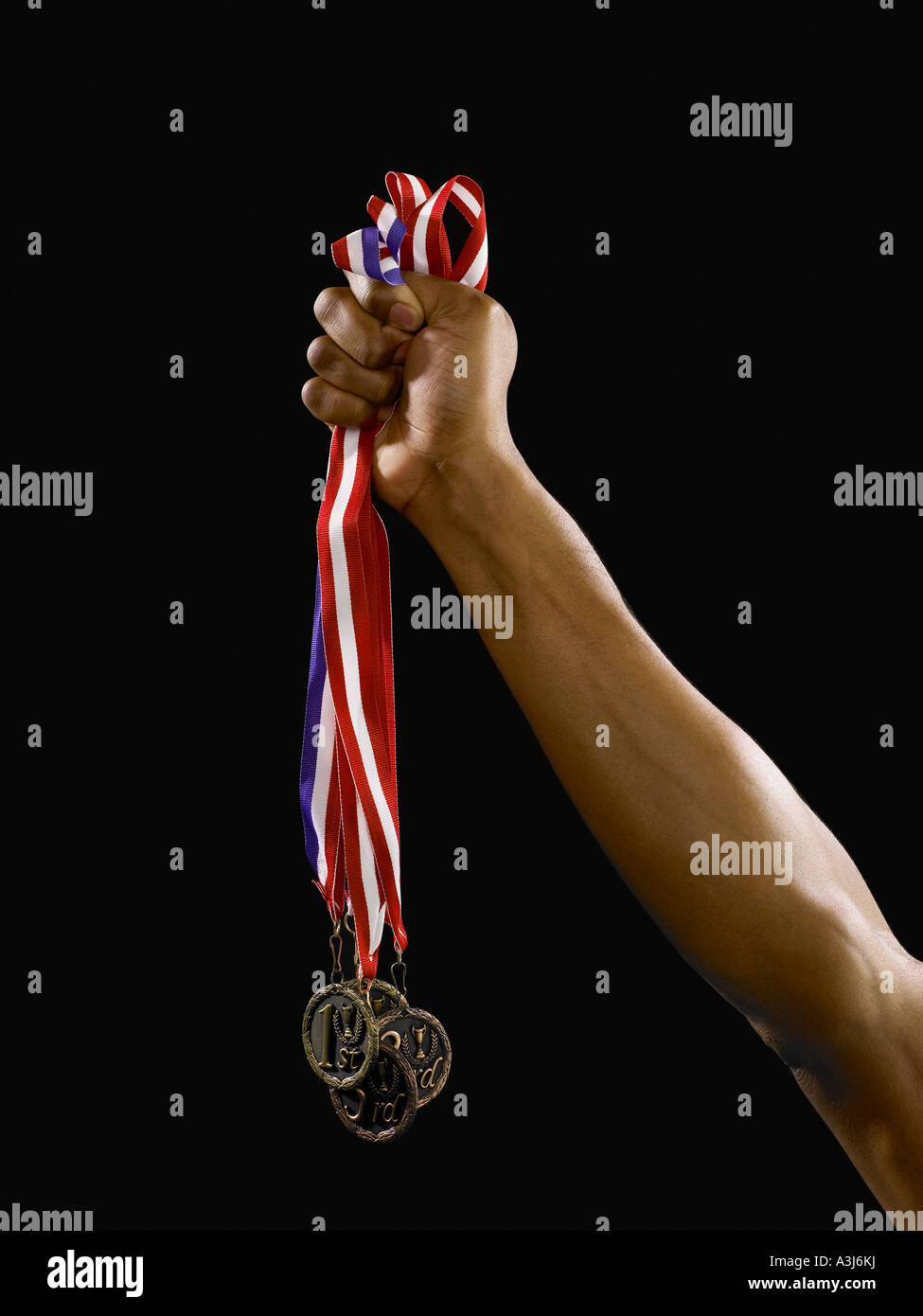 Person holding medals Stock Photo - Alamy