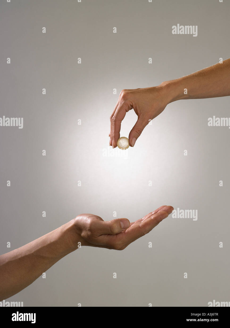 Female hand dropping coin hi-res stock photography and images - Alamy