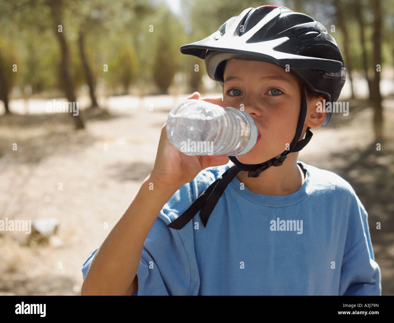 Boy drinking water Stock Photo - Alamy