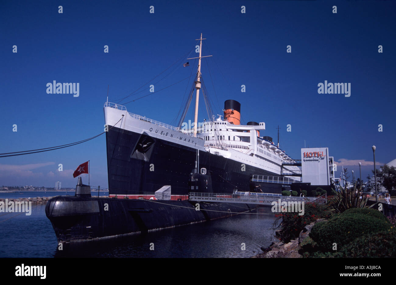 The Queen Mary ocean liner moored alongside the Russian submarine ...