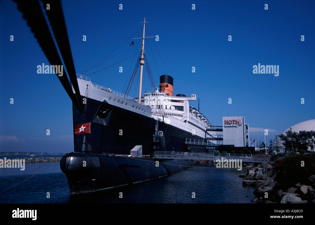 The Queen Mary ocean liner moored alongside the Russian submarine ...