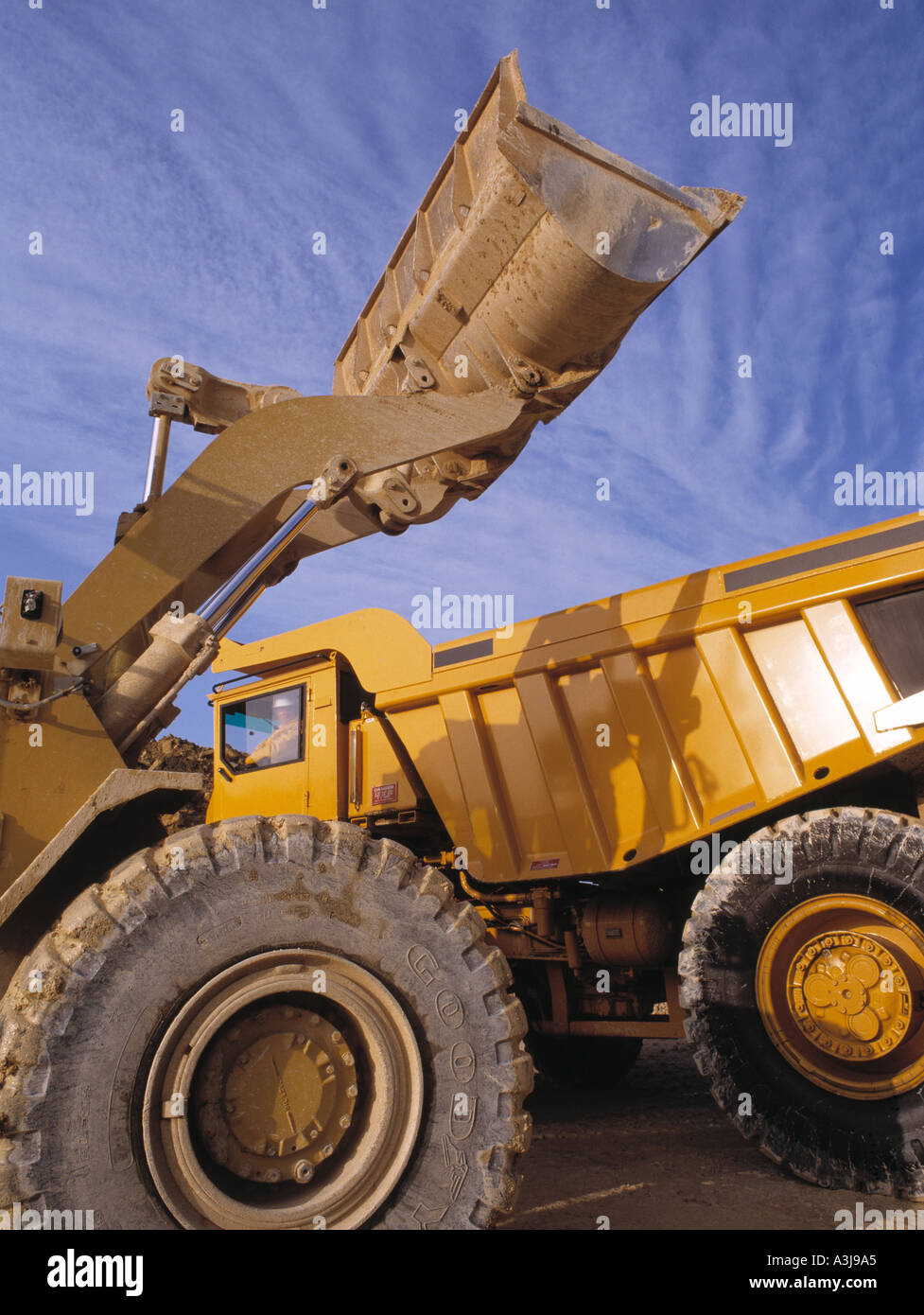 EARTHMOVING EQUIPMENT DIGGER AND TRUCK Stock Photo - Alamy