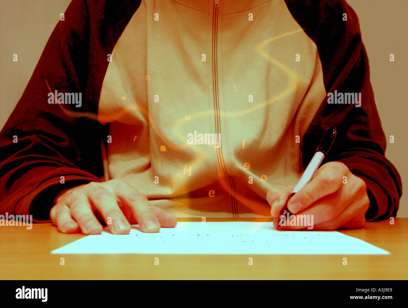 man writing a letter with abstract floating type Stock Photo - Alamy