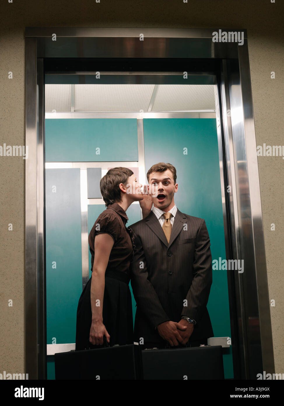 Two businessmen in elevator High Resolution Stock Photography and ...