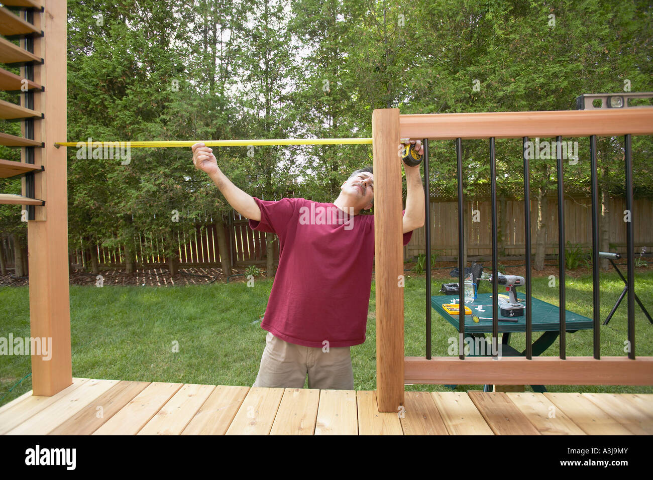 Tree Building Man Standing Alone Outside High Resolution Stock ...