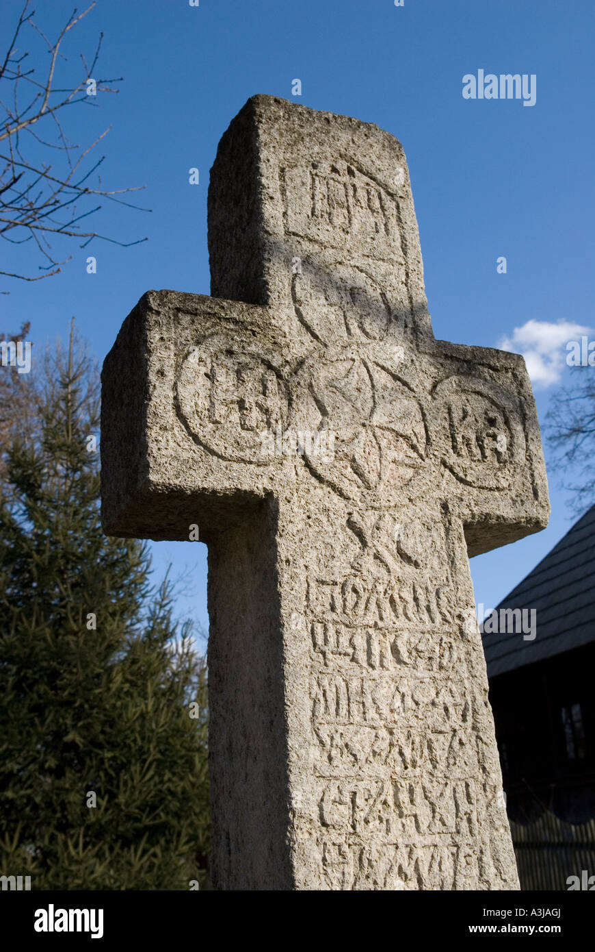 Old carved stone cross displayed at the ethnographic Village Museum ...