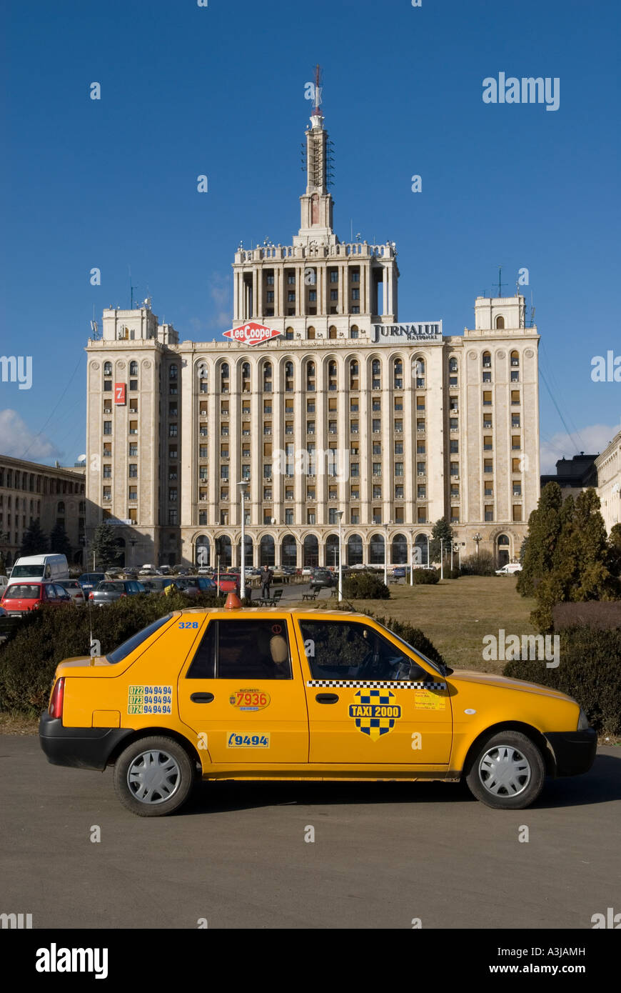 Taxicab next to Casa Presei Libere, the headquarters of various ...