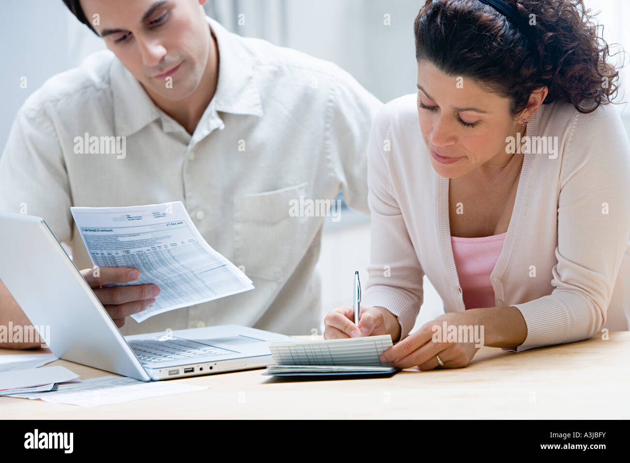 Couple sorting out home finances Stock Photo - Alamy