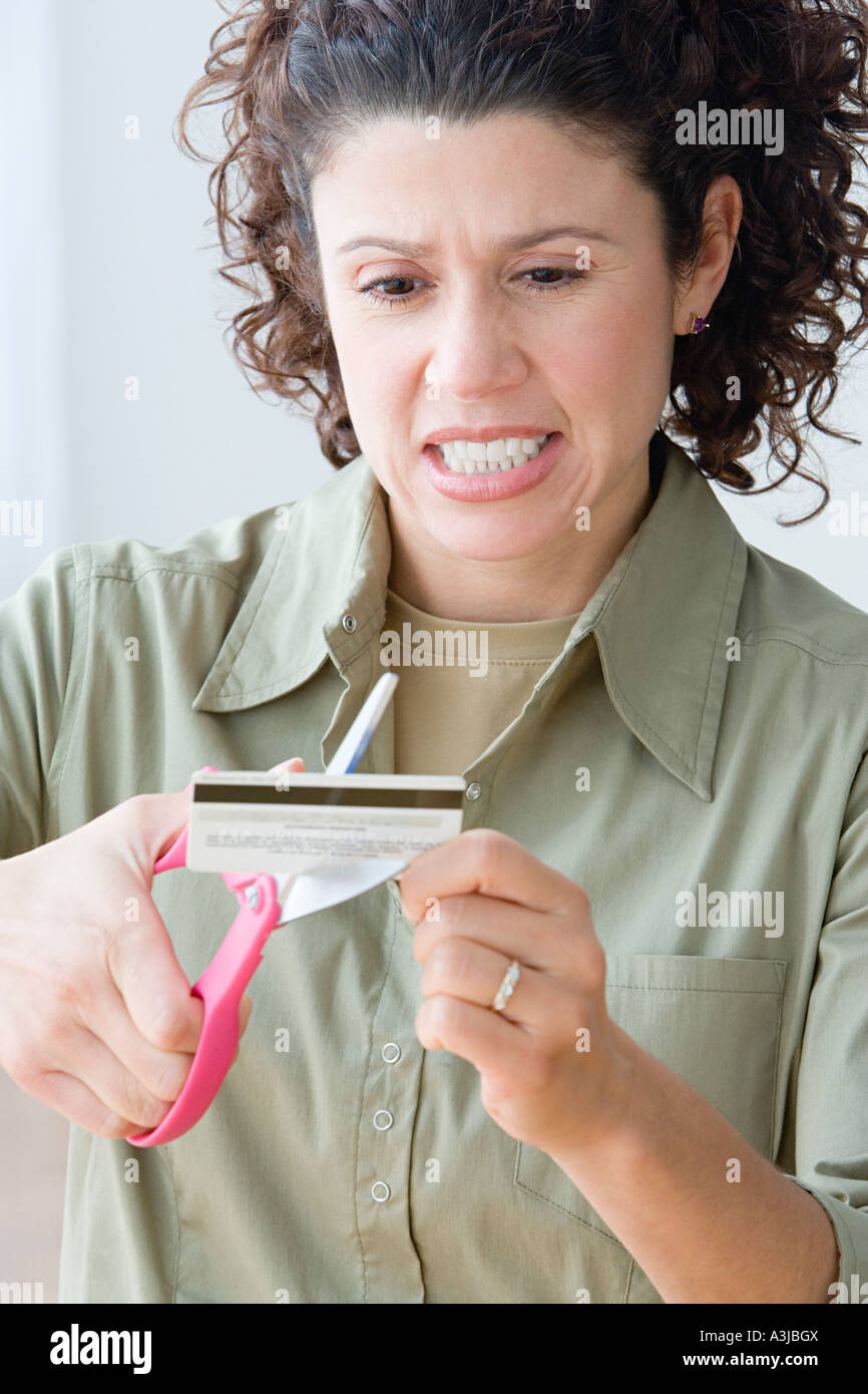 Cutting up the credit card hi-res stock photography and images - Alamy