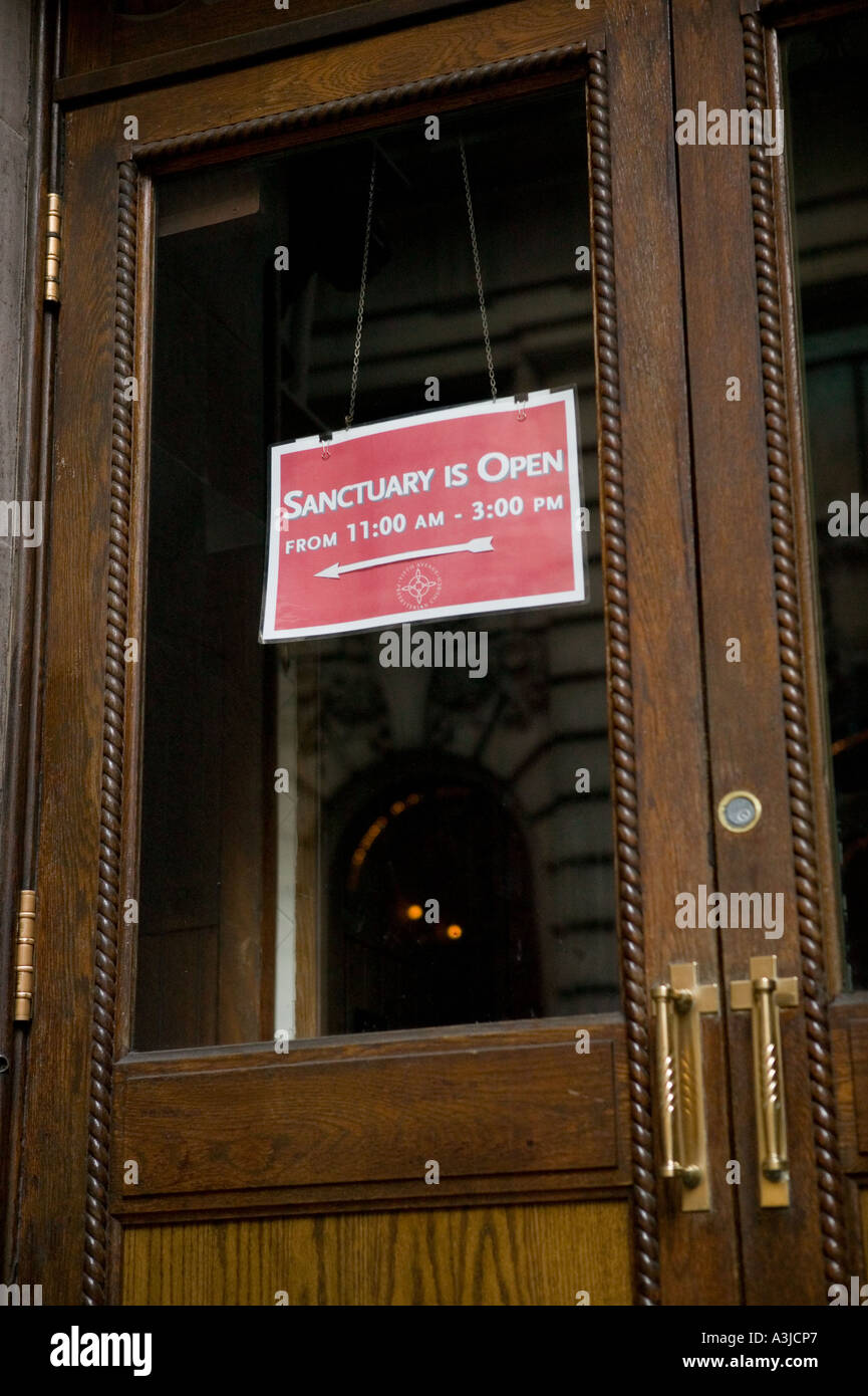 Wooden door with sign saying SANCTUARY IS OPEN Stock Photo - Alamy