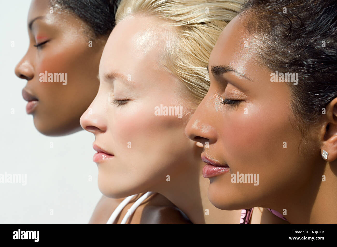 Profile of three young women Stock Photo - Alamy
