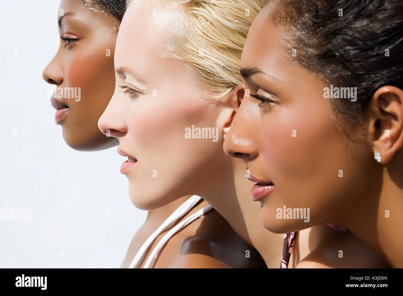 Profile of three young women Stock Photo - Alamy