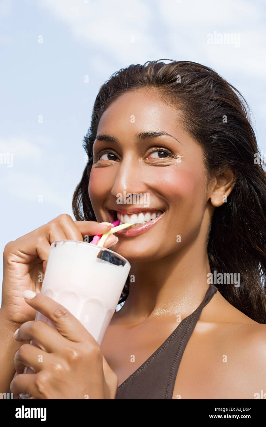 Woman drinking milkshake hi-res stock photography and images - Alamy