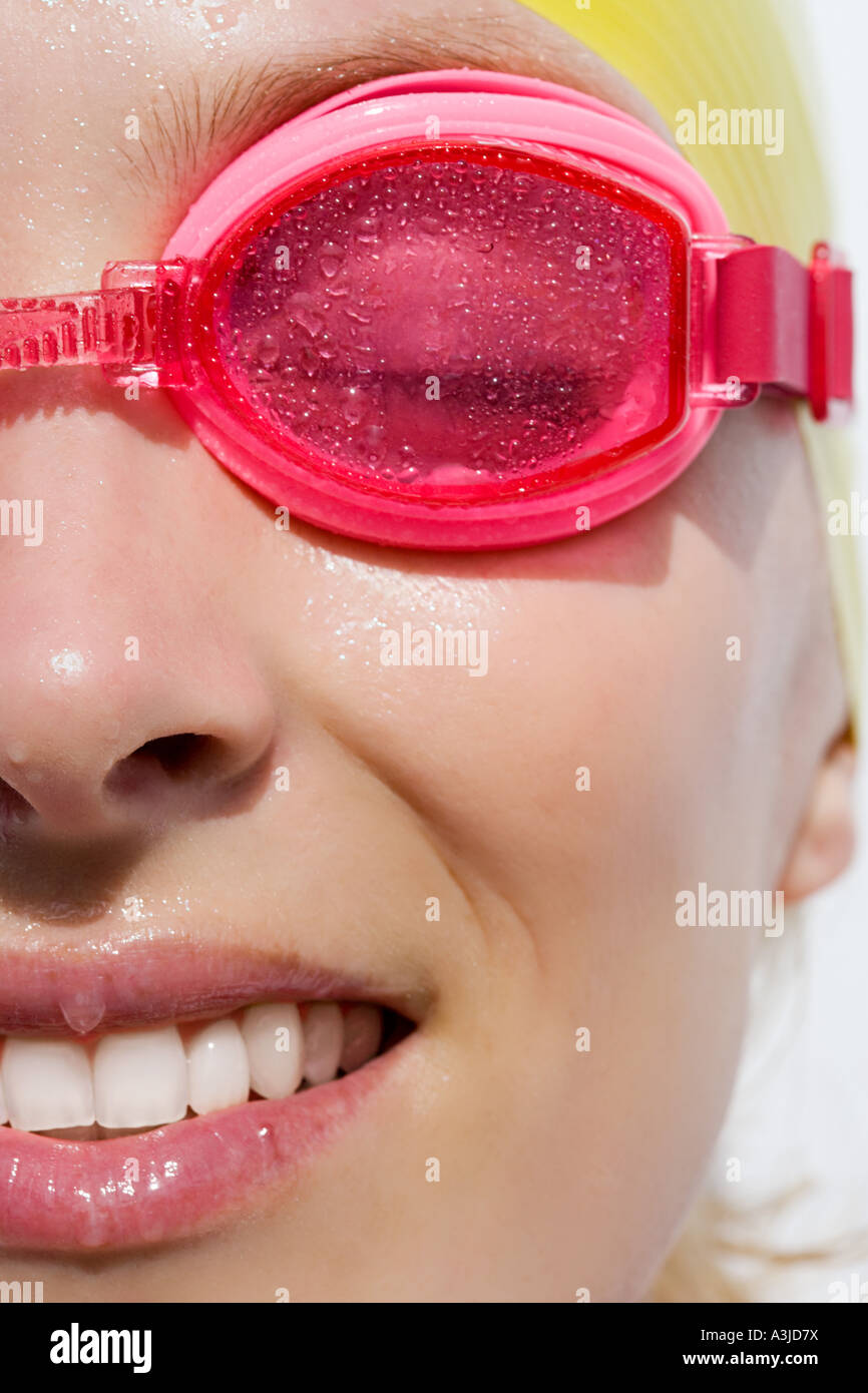 Woman wearing swimming goggles Stock Photo - Alamy