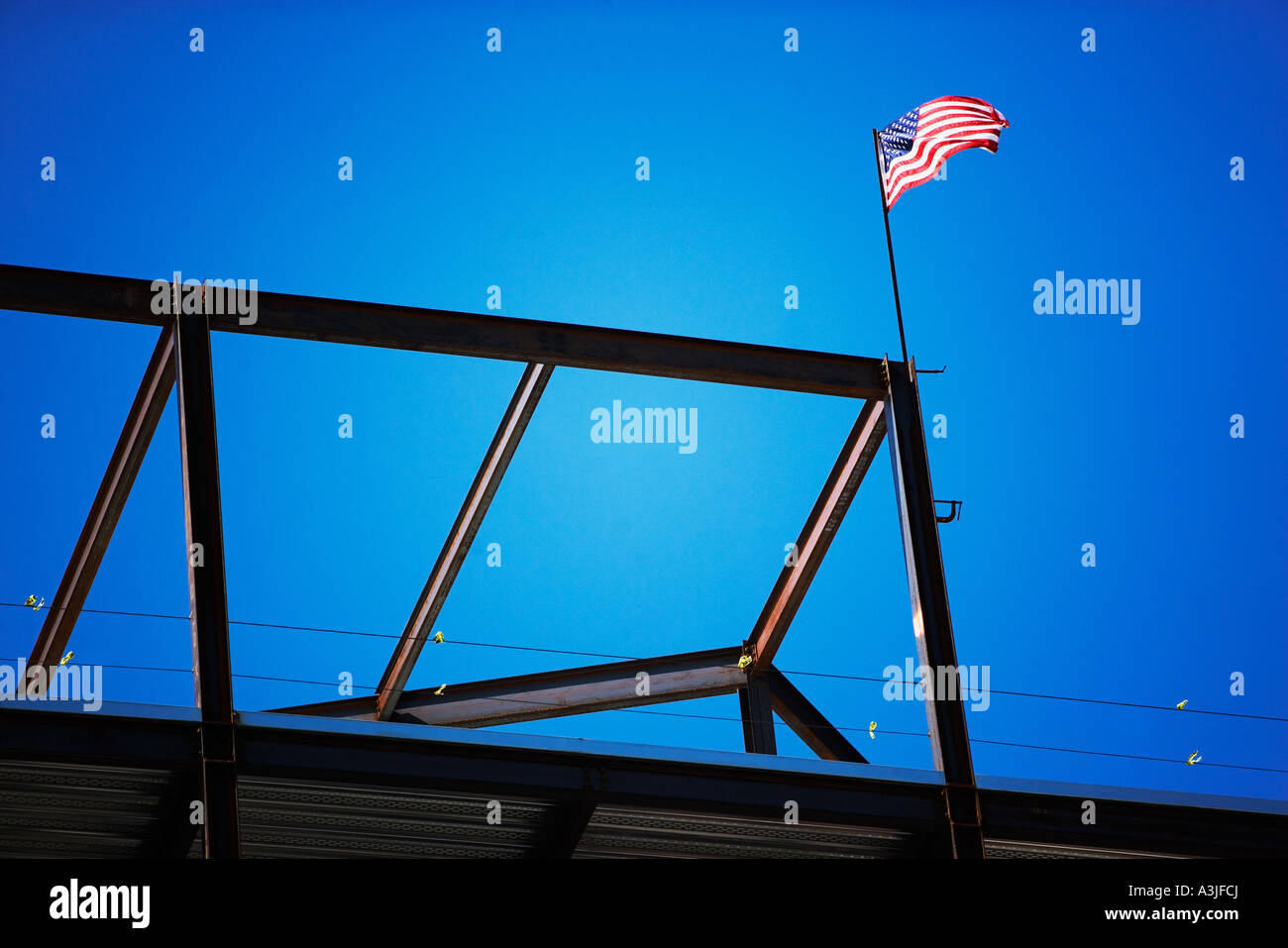 American flag on construction framework Stock Photo - Alamy
