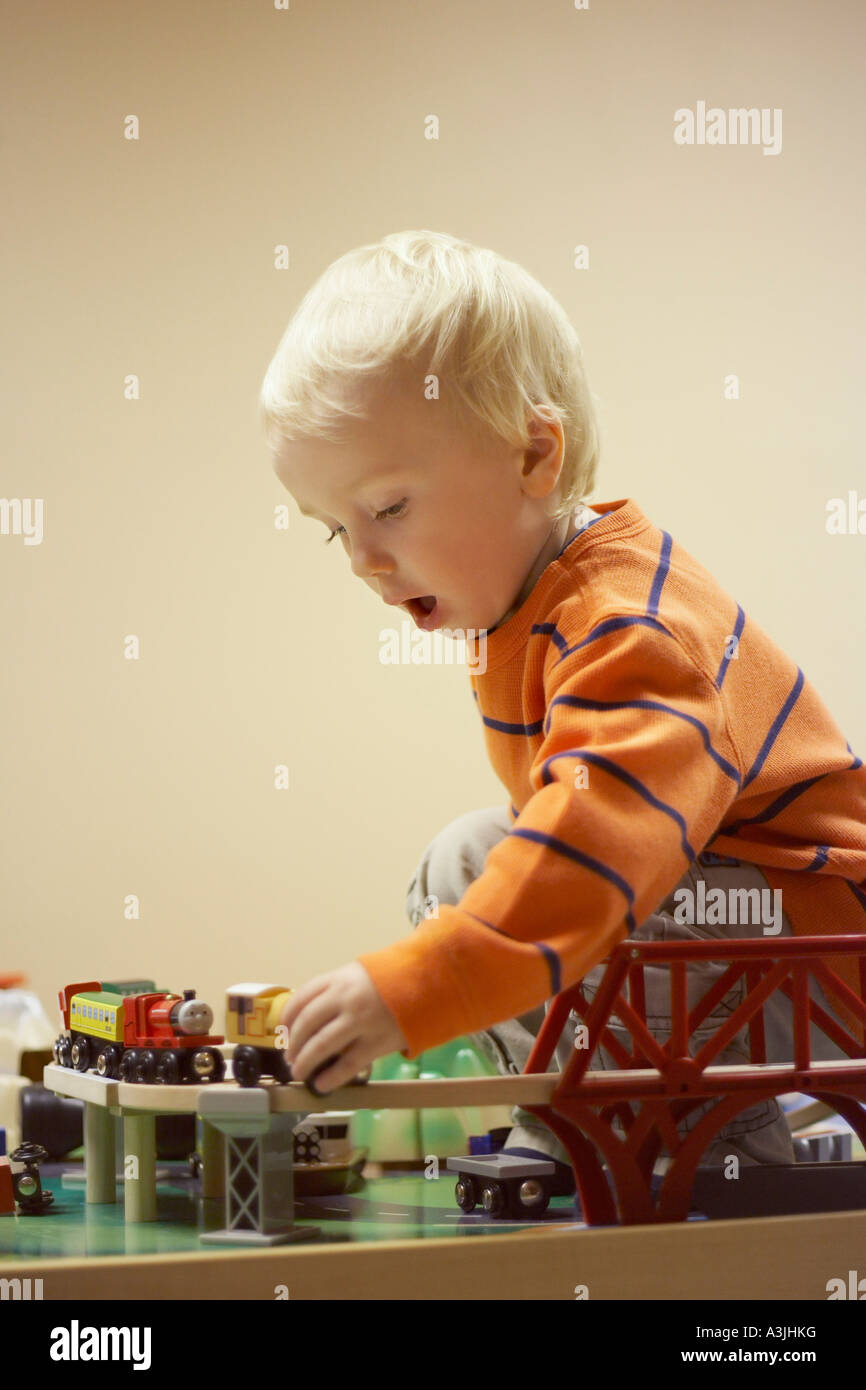 Boy Playing With Train Set Stock Photo - Alamy