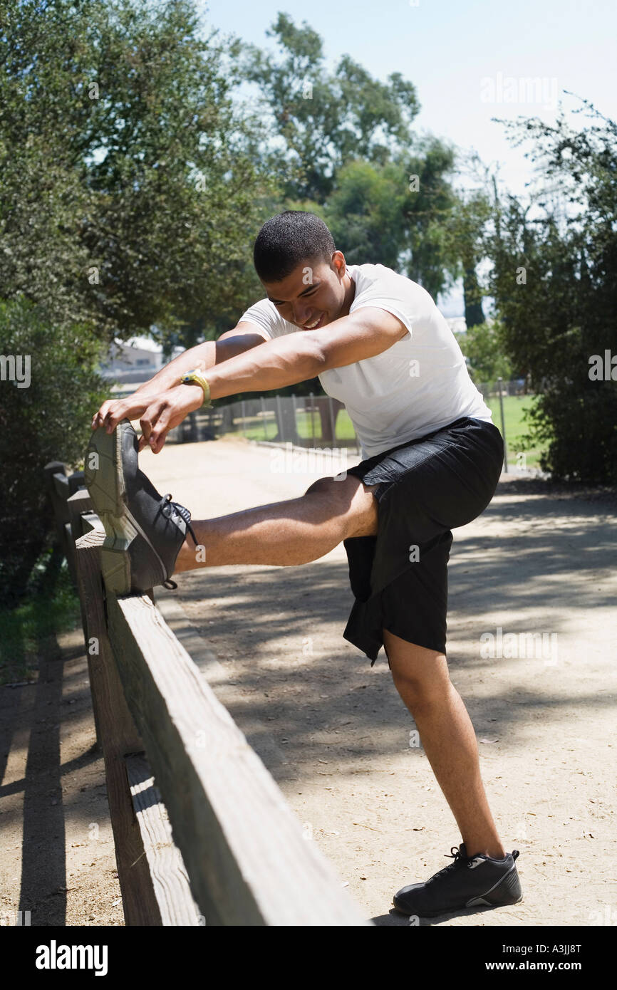 Stretching over fence hi-res stock photography and images - Alamy