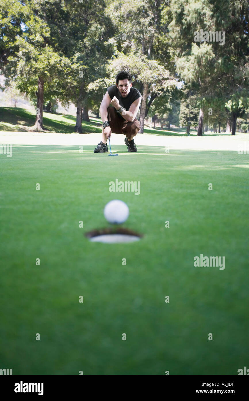 Man Watching Golf Ball Stock Photo - Alamy