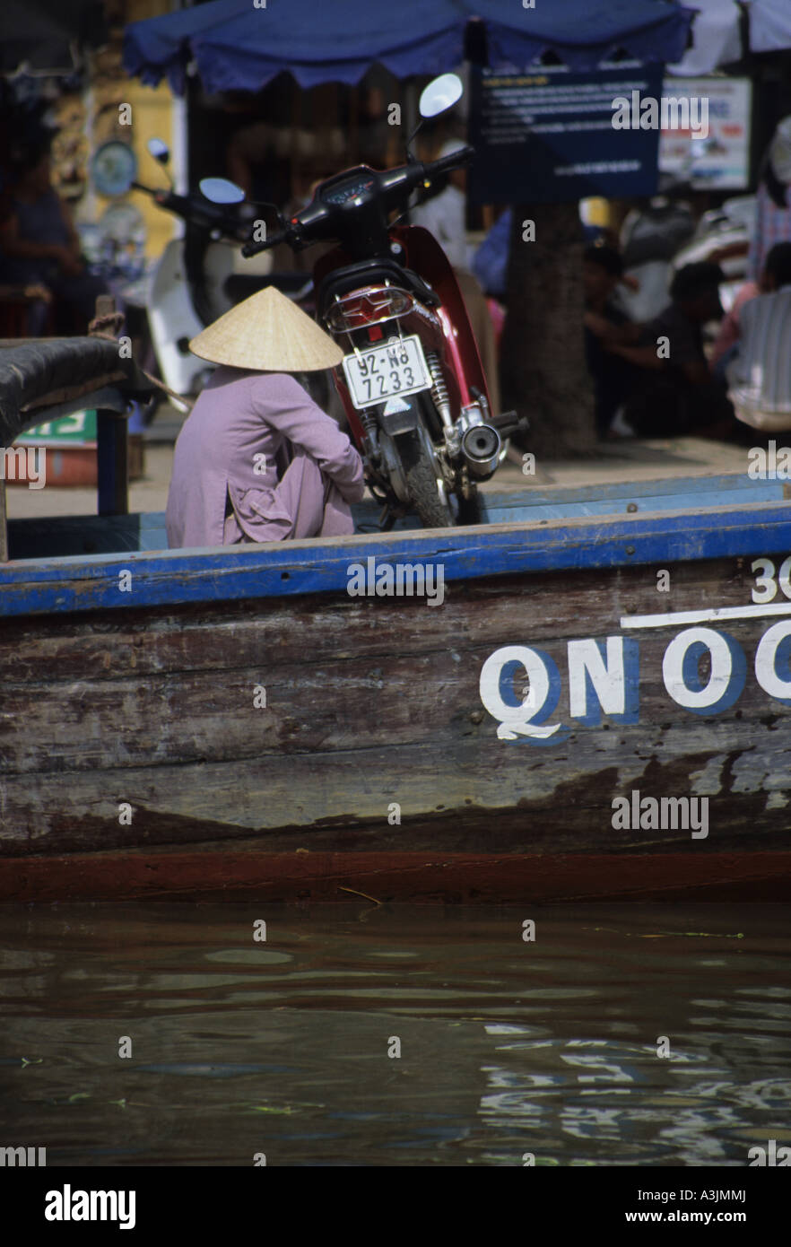 Woman beside motorbike on boat Stock Photo - Alamy