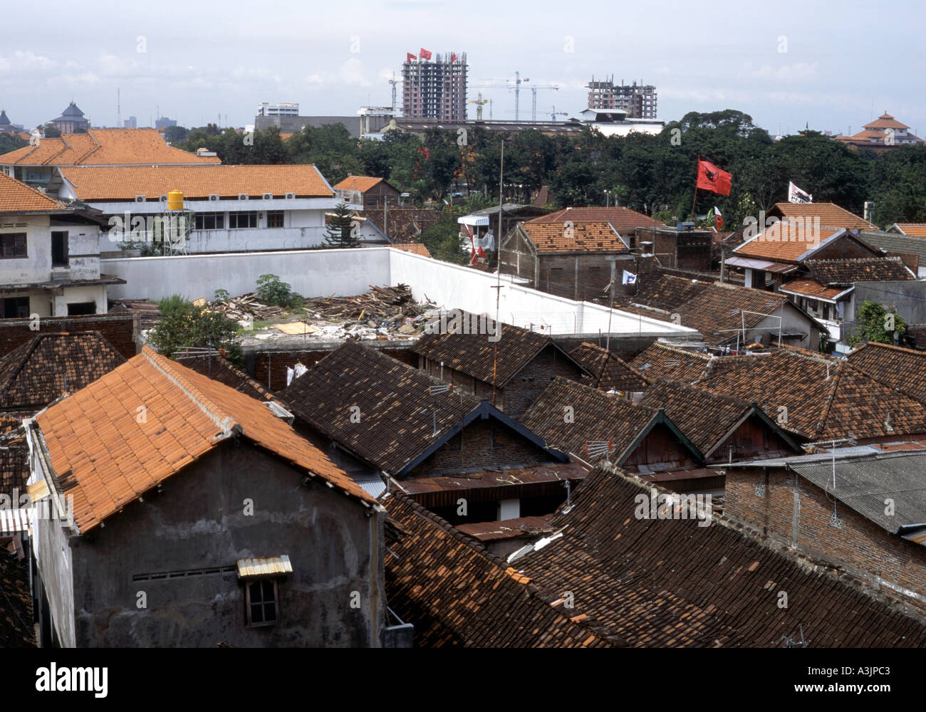 Traditional old style houses in contrast to the modern buildings ...