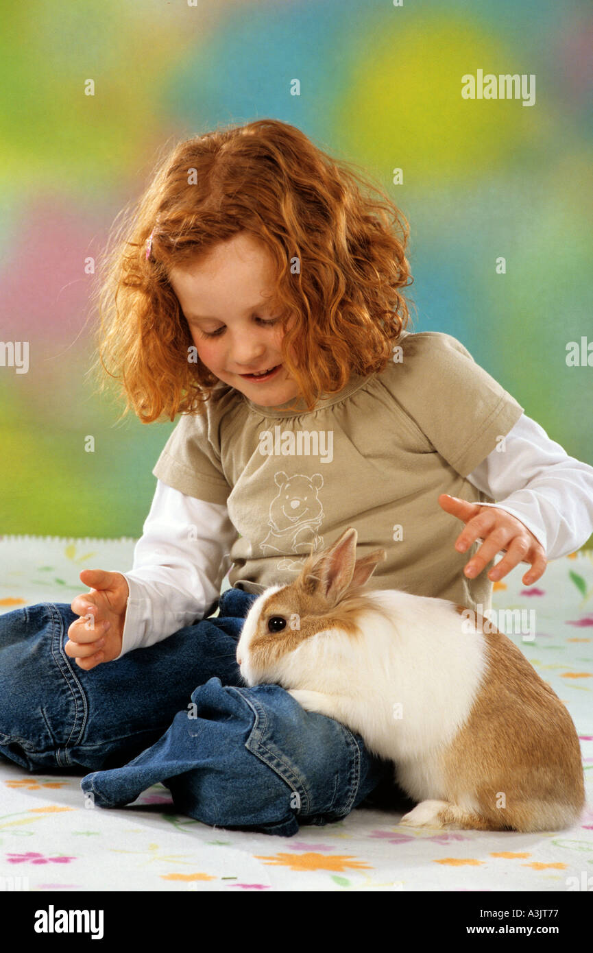 girl with pygmy rabbit on her lap Stock Photo - Alamy
