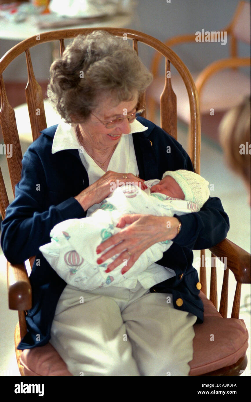 Great grandmother age 85 holding newborn grandson after birth. Edina ...
