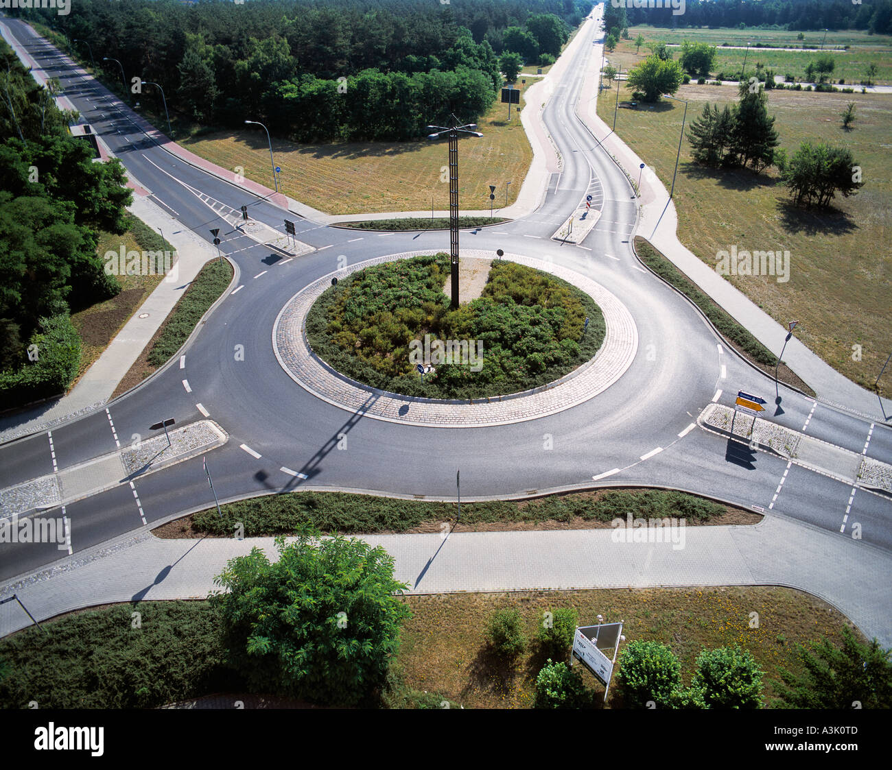 traffic control, panoramic view to a round-about traffic with four ...