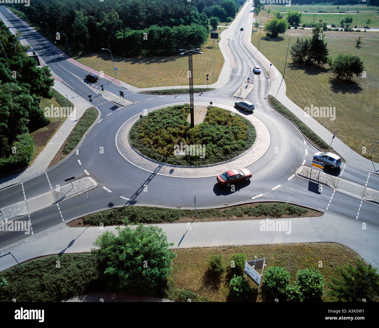 traffic control, panoramic view to a round-about traffic with four ...