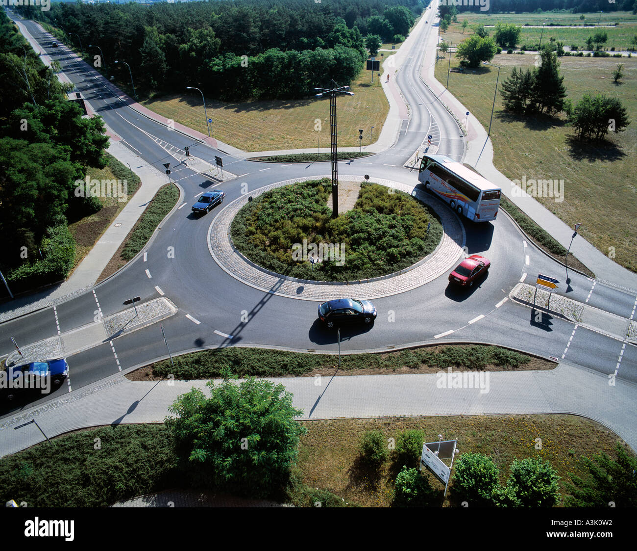 traffic control, panoramic view to a round-about traffic with four ...