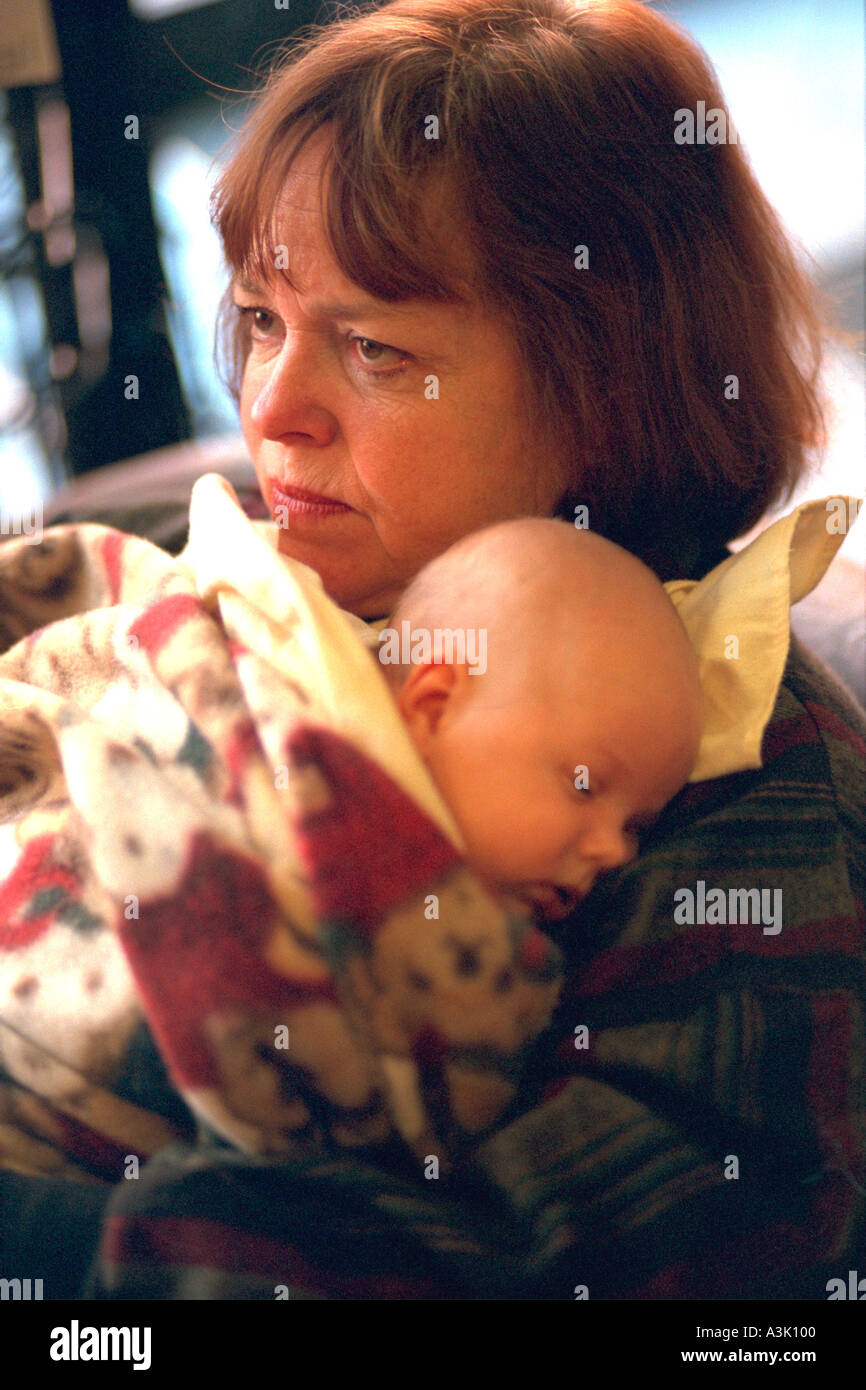 Grandmother age 57 holding newborn grandson after delivery. Minneapolis ...