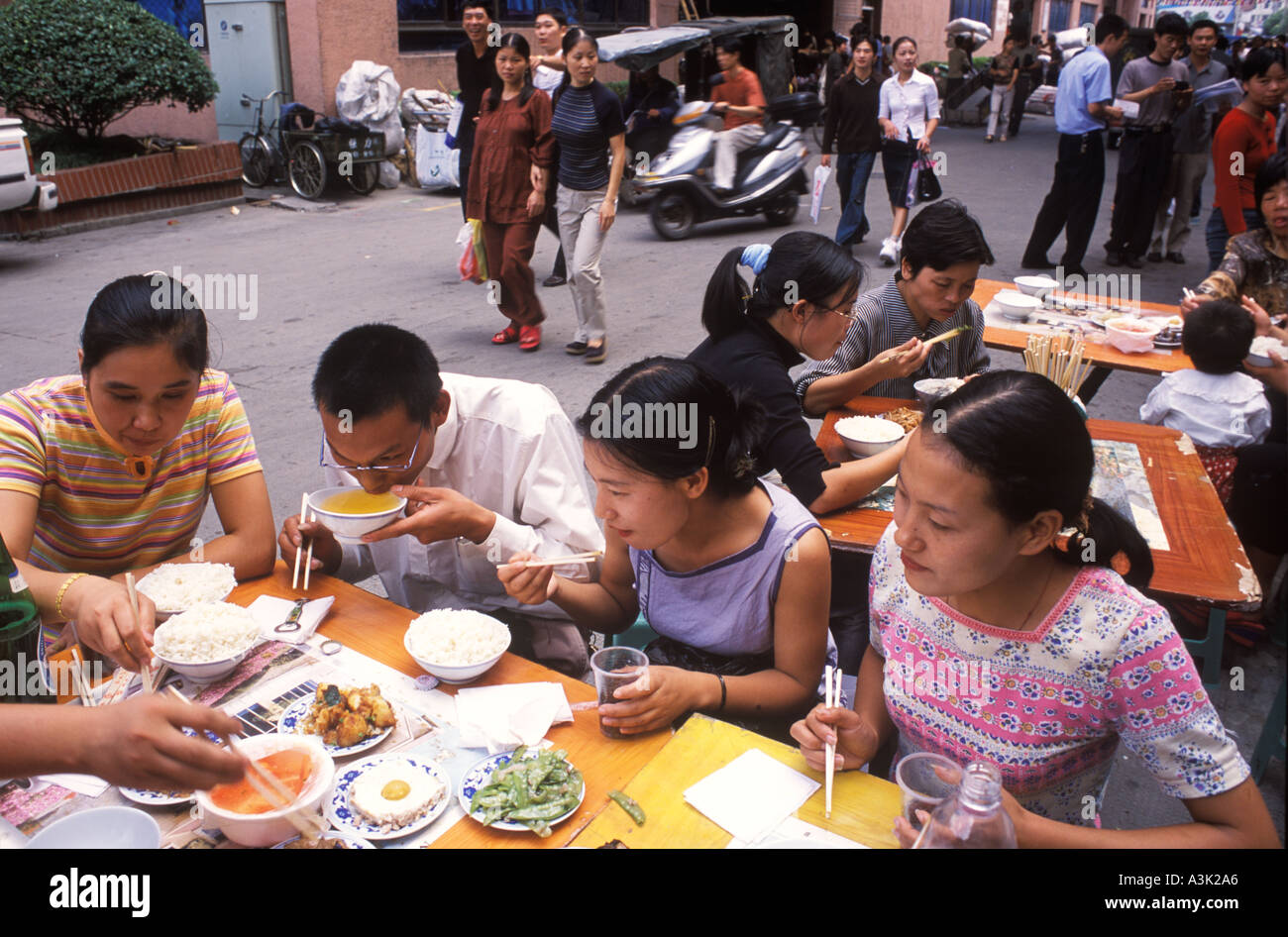 China 2000s Working class Chinese office workers eating lunch a meal ...