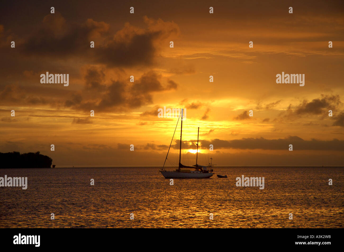Sunset with a yacht over Port Vila harbour in Vanuatu Stock Photo - Alamy