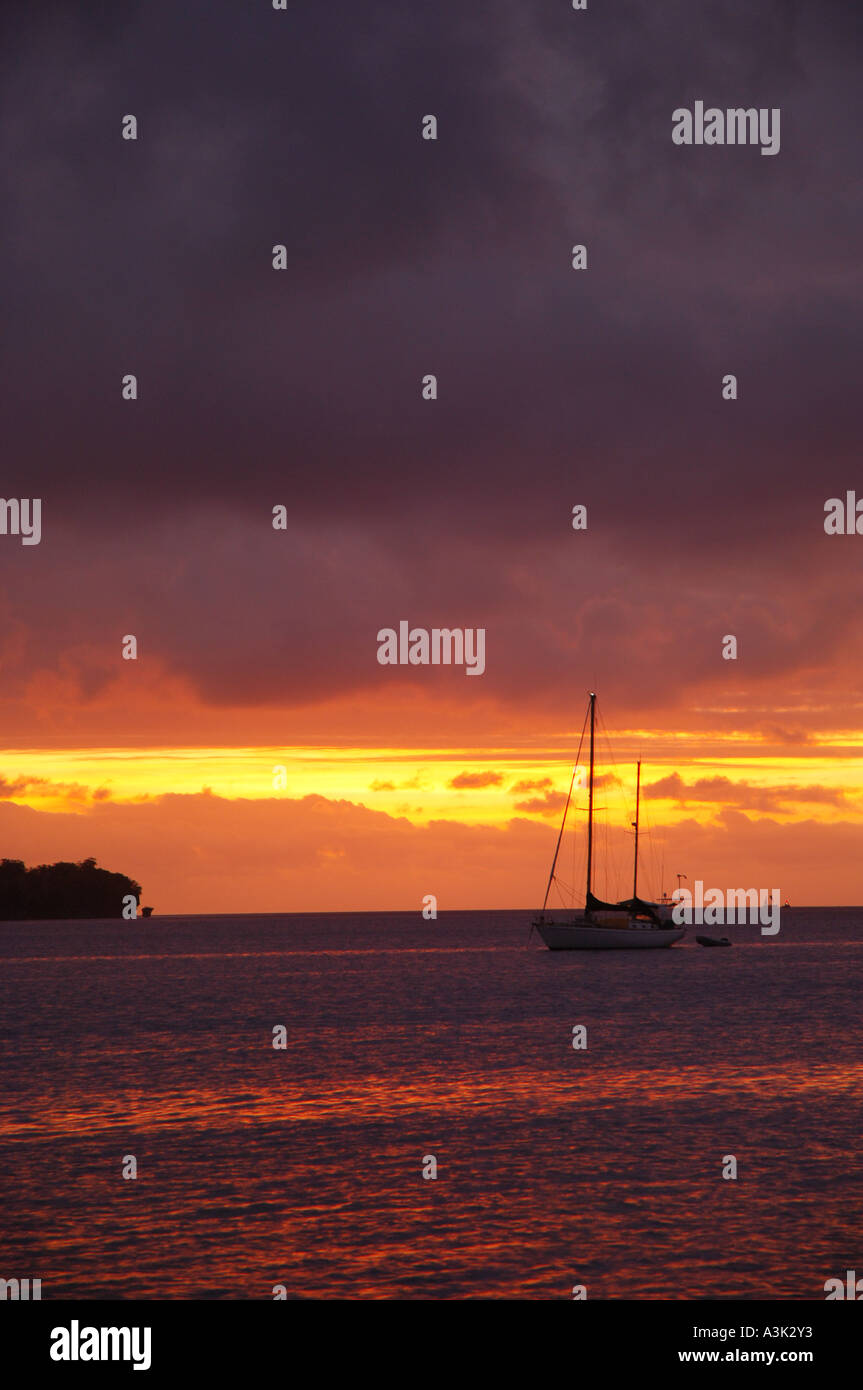 Sunset with a yacht over Port Vila harbour in Vanuatu Stock Photo - Alamy