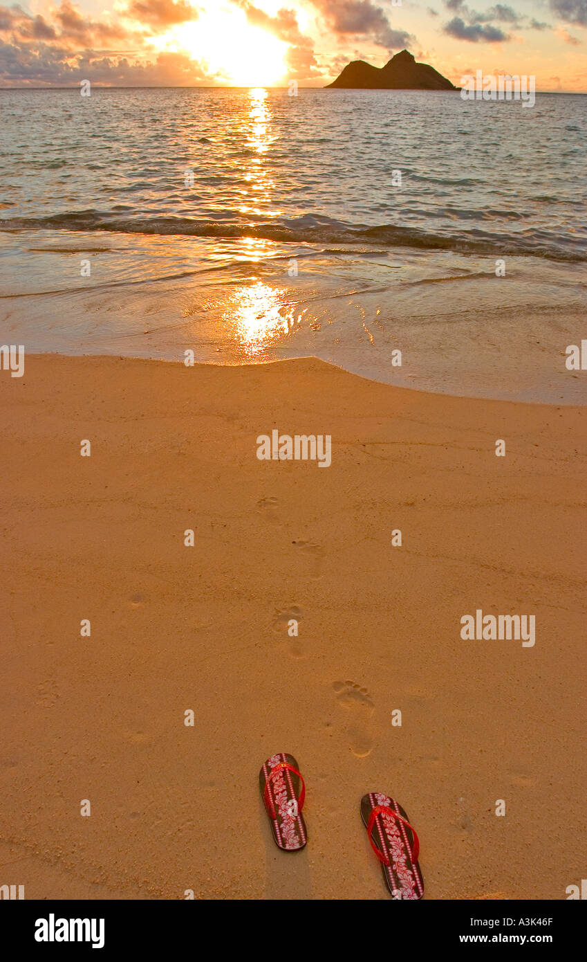 sandals footprints on the sand Stock Photo - Alamy