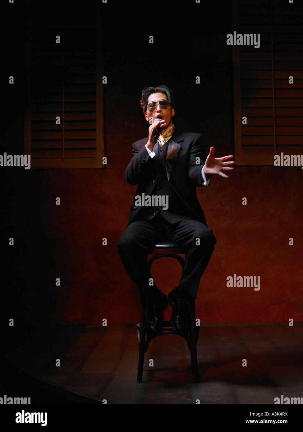 Singing man black suit microphone hi-res stock photography and images ...