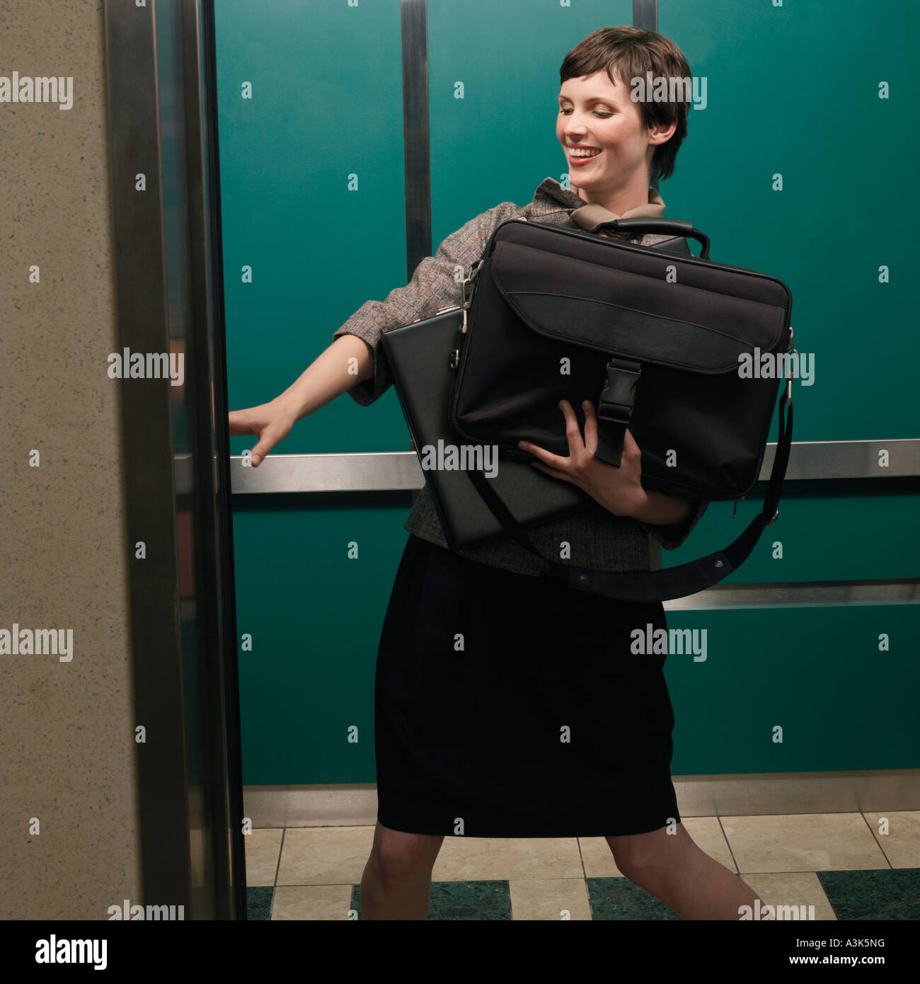 Woman in elevator alone hi-res stock photography and images - Alamy